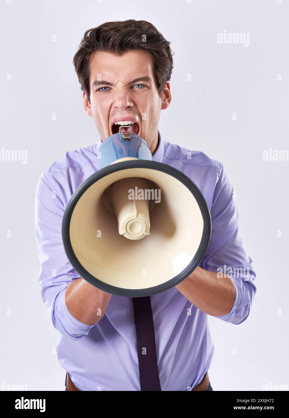 Businessman, scream and megaphone by portrait in studio for ...