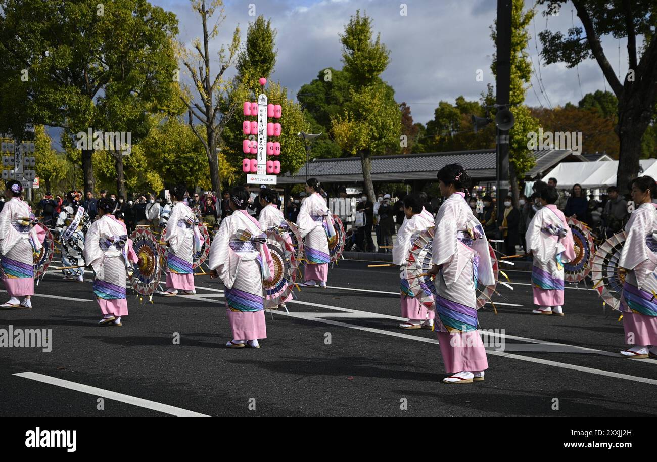 Kasa Odori dancers wearing a yukata participating at the Himeji Castle ...