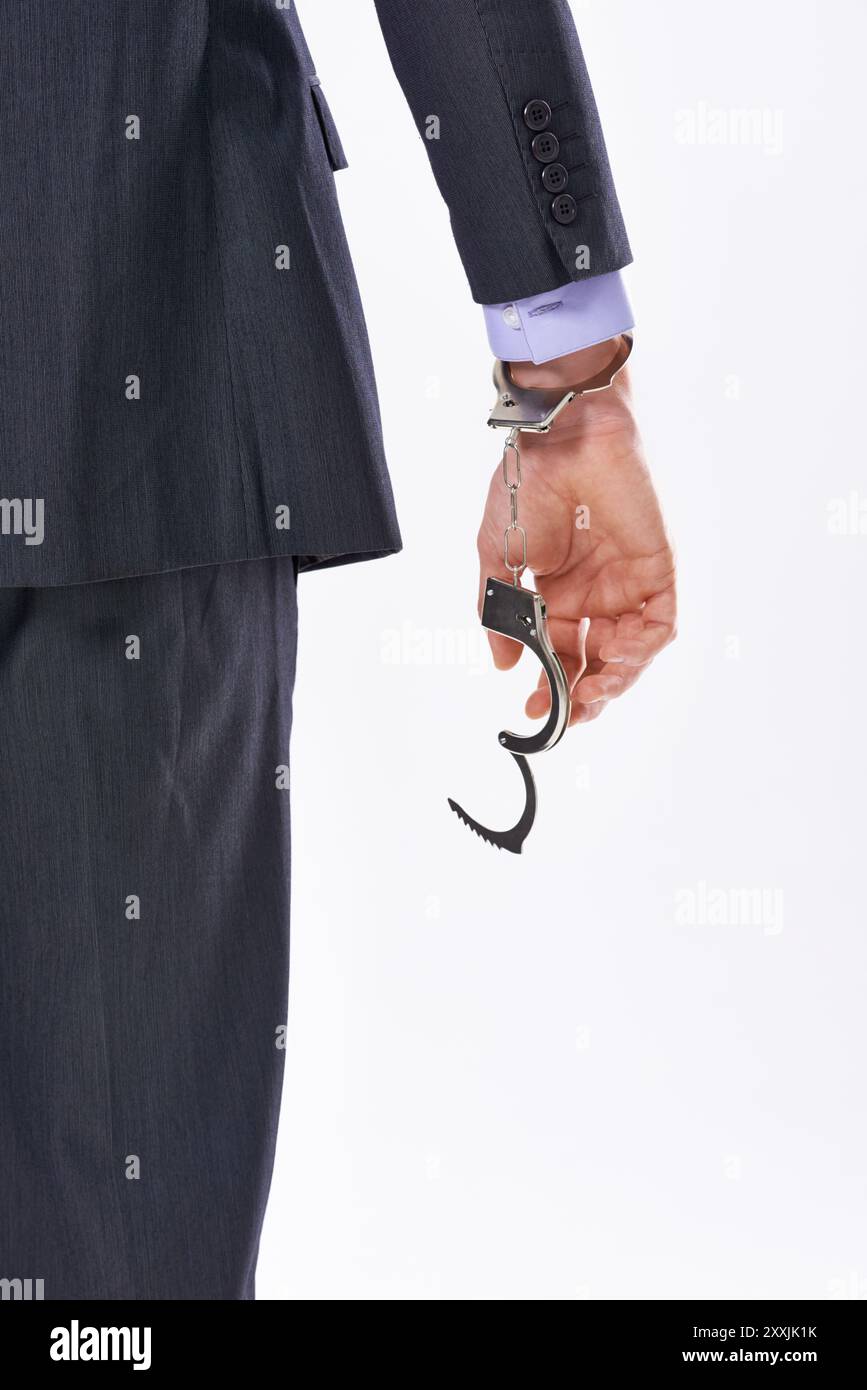 Hands, business and person with handcuffs in studio for security ...