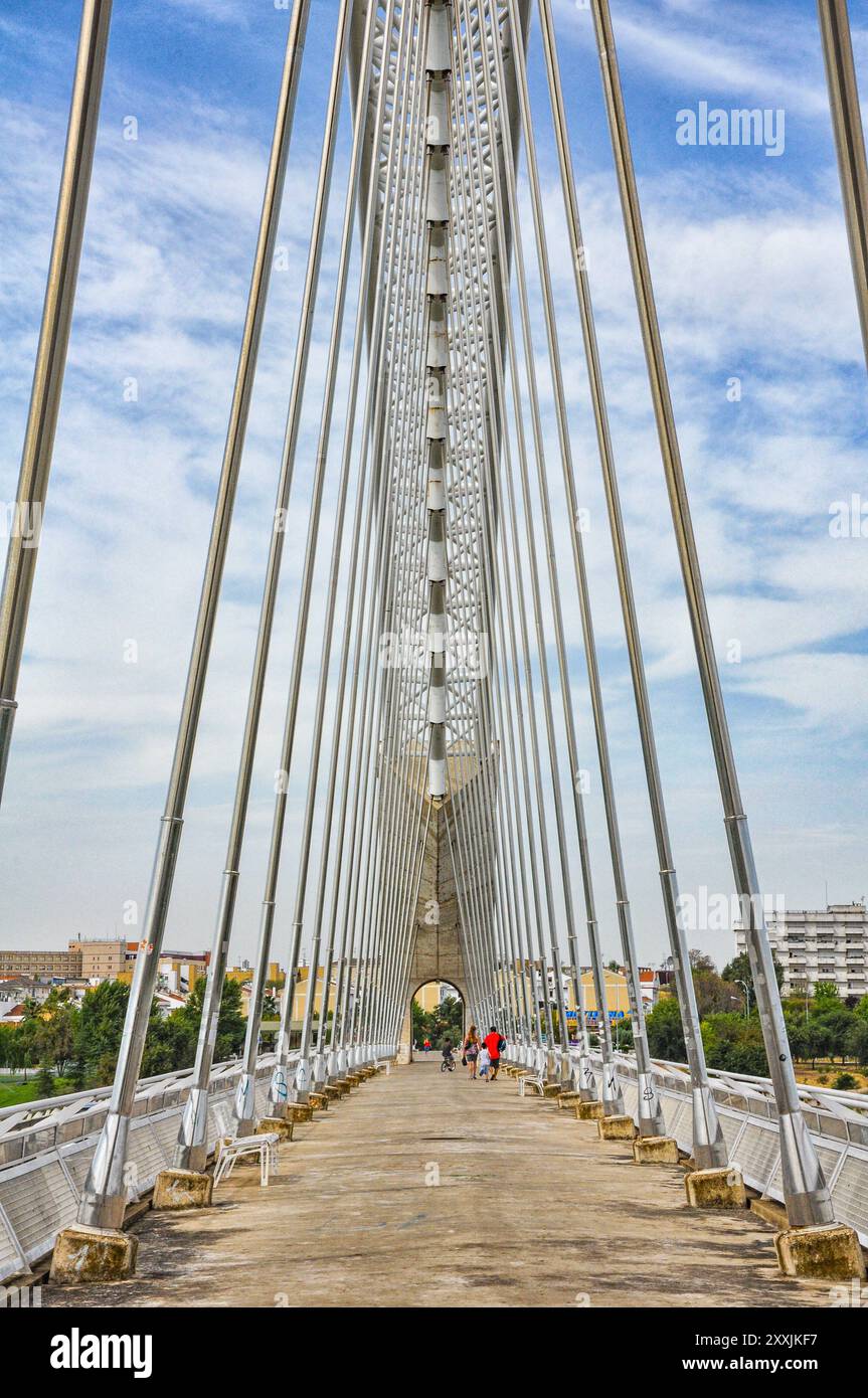 The modern 20th-century Lusitania Bridge, a sleek suspension bridge ...