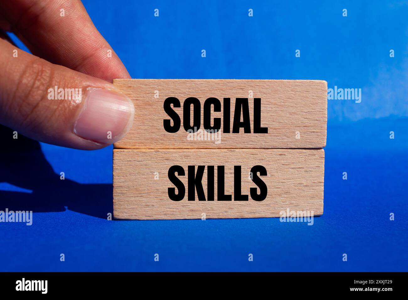 Social skills message written on wooden blocks with blue background ...
