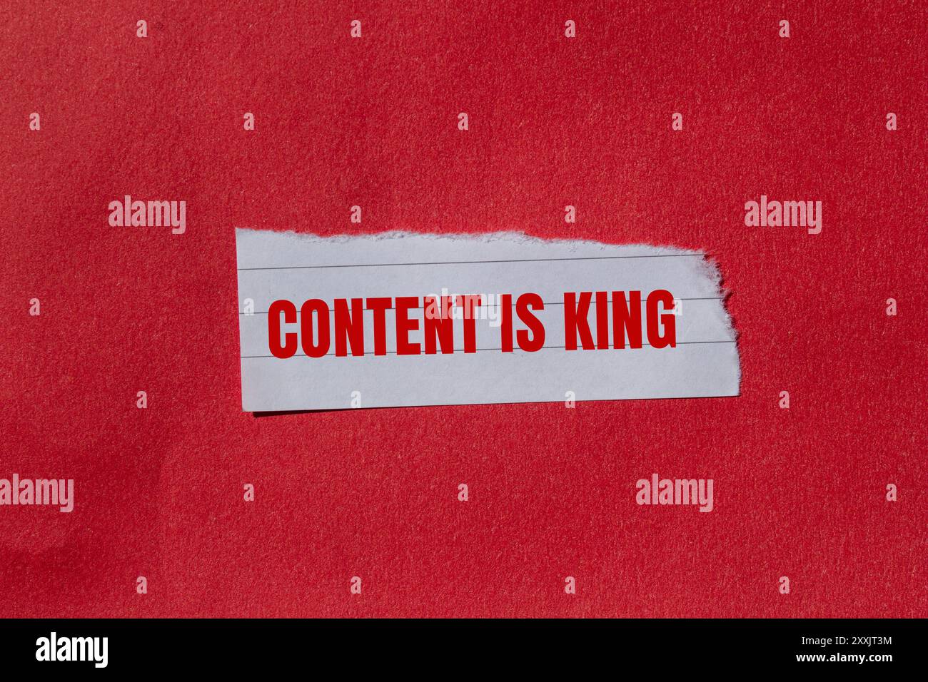 Content is king message written on ripped torn paper piece with red background. Conceptual ...