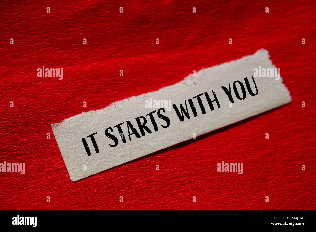It starts with you message written on torn paper with red background ...