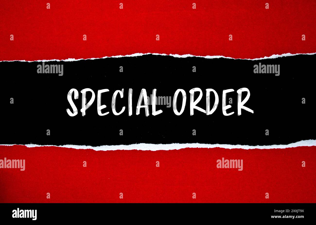 Special order message written on ripped torn red paper with black ...