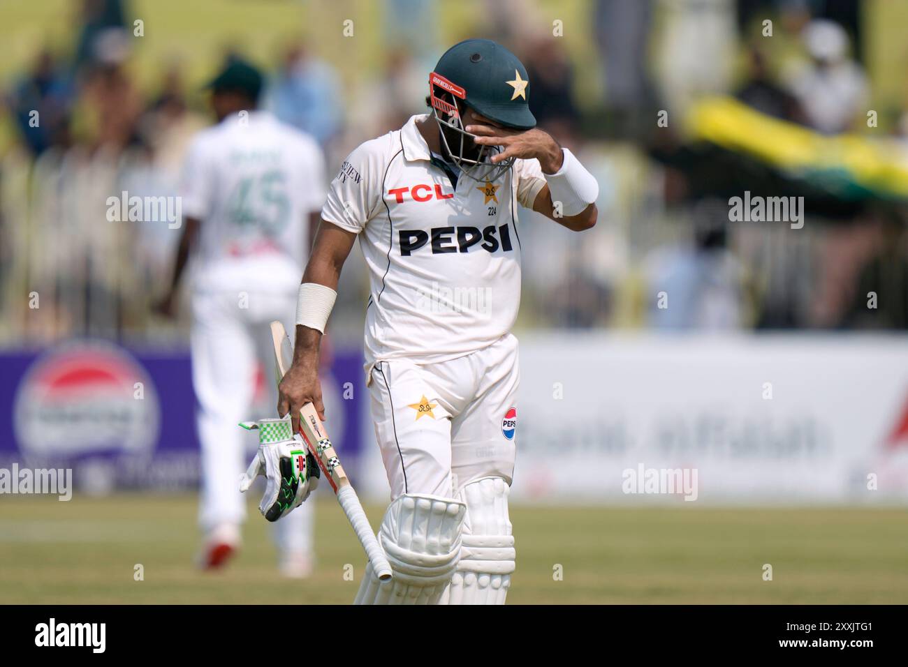Pakistan's Mohammad Rizwan reacts as he walks off the field after his ...