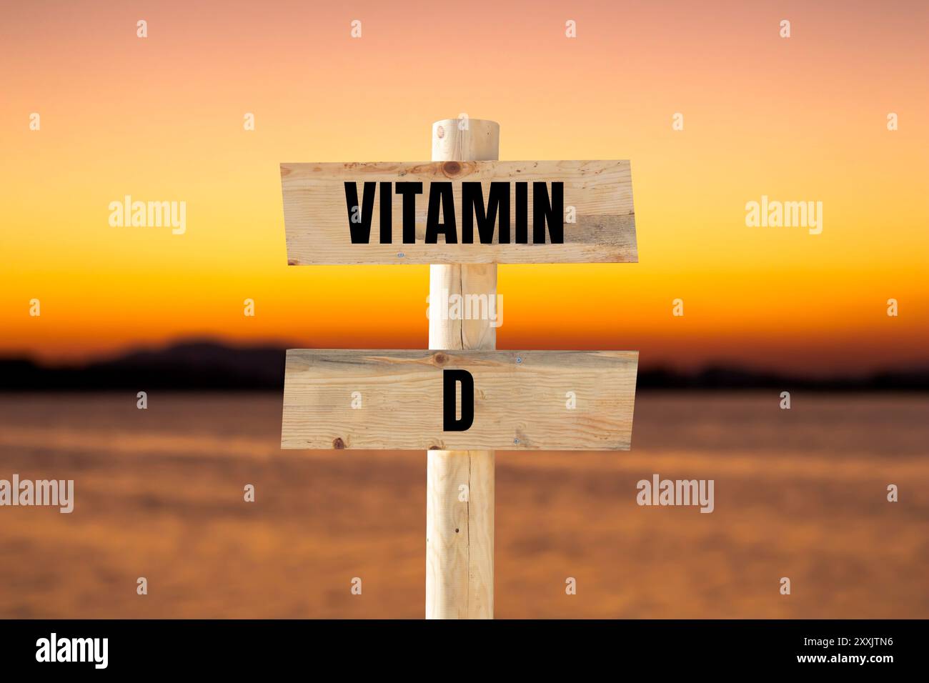 Vitamin d message written on wooden sign with blurry lake background ...