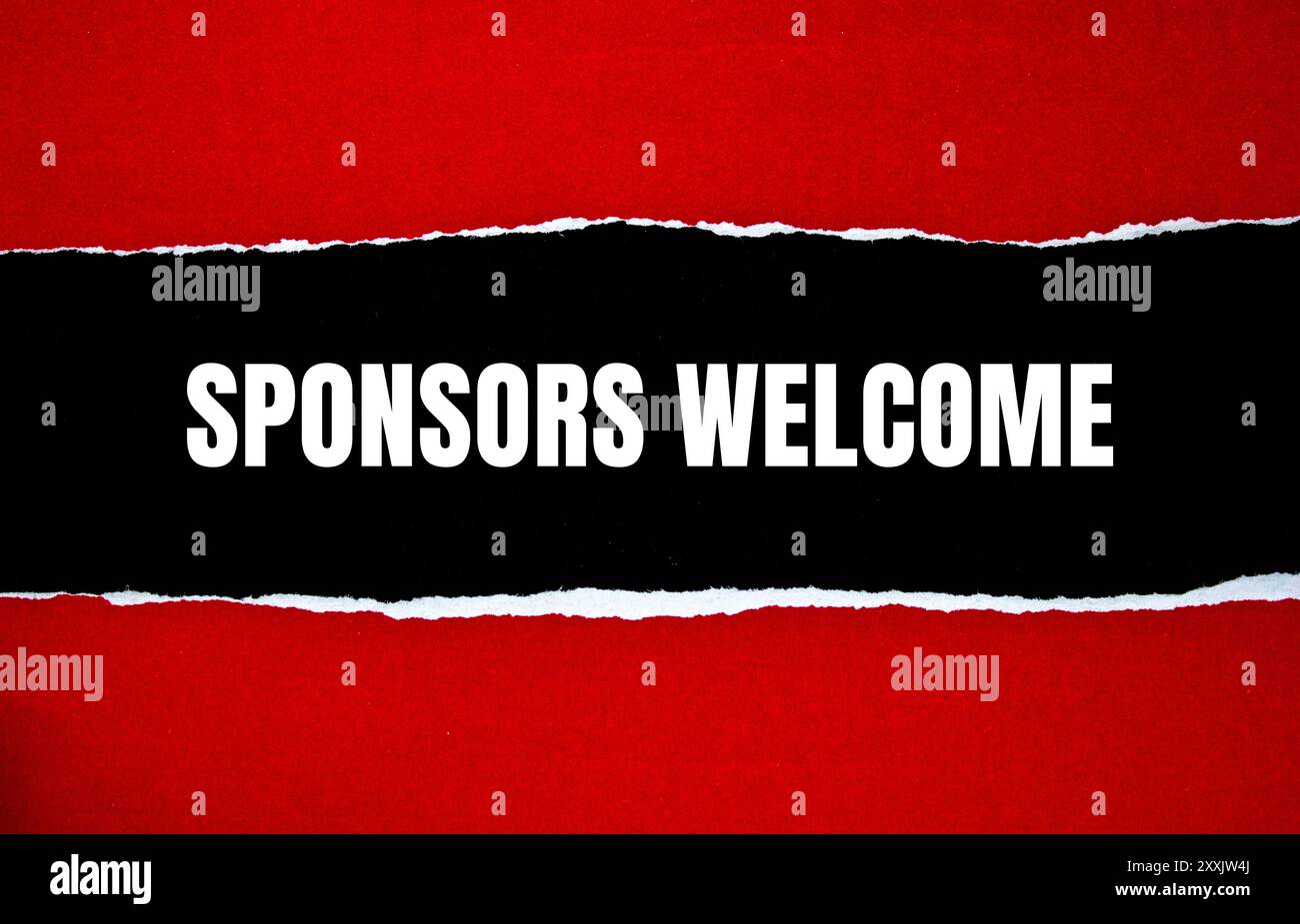 Sponsors welcome message written on ripped torn red paper with black ...