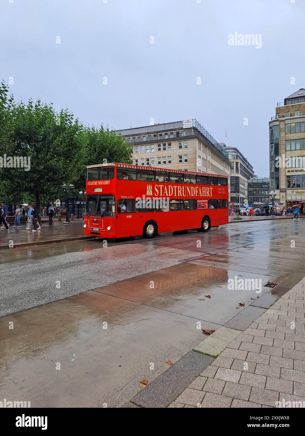 HAMBURG, GERMANY - AUGUST 14, 2024: Red hop on hop off sightseeing bus ...