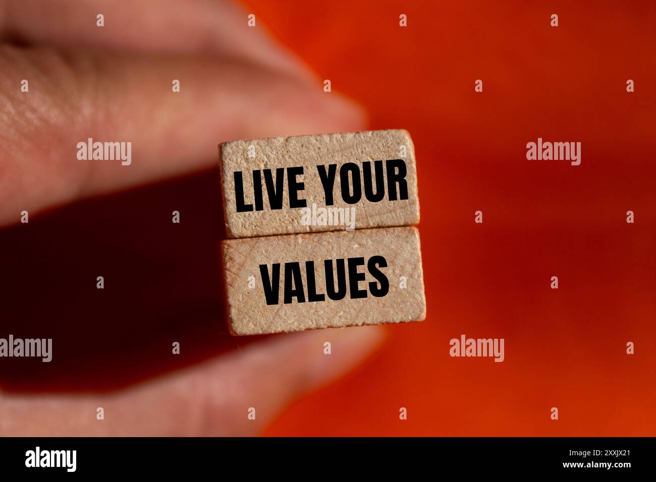 Live your values message written on wooden blocks with orange ...