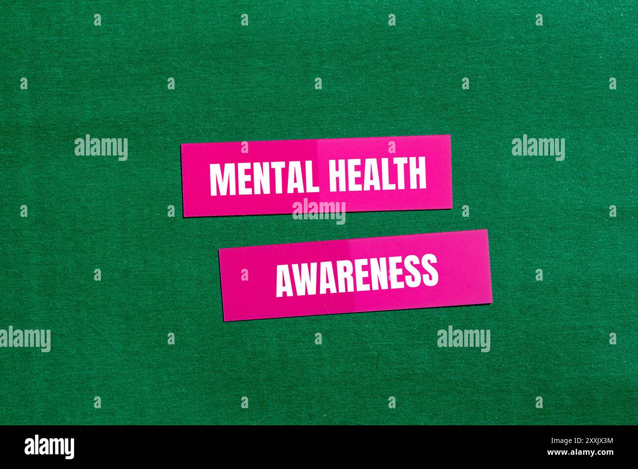 Mental health awareness message written on pink paper with green ...