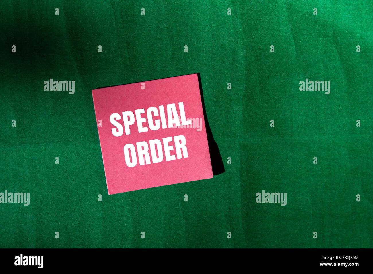 Special order message written on pink paper with green background ...