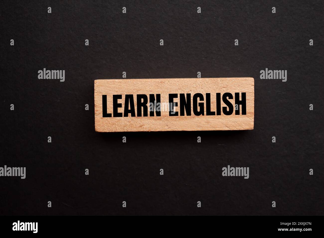 Learn english message written on single wooden block with black ...
