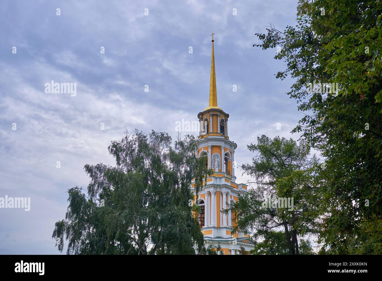 A tall bell tower with a gilded spire. Old Russian architecture Stock ...