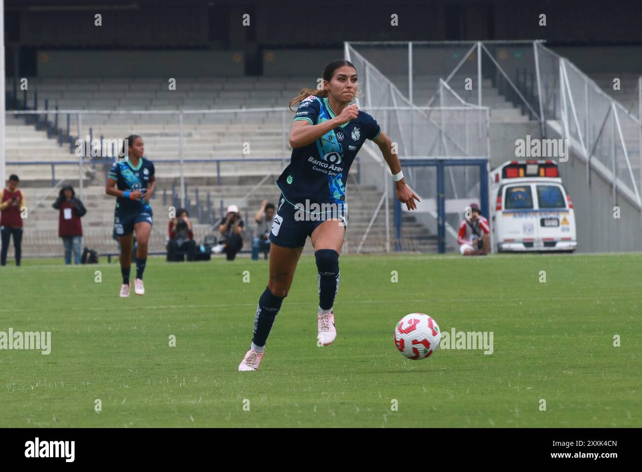 Sebelle Rojas #7 of Club Puebla drives the ball forward during the 7th ...