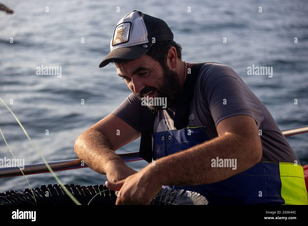 A fisherman poses during a day of fishing in the bay of Cadiz The ...