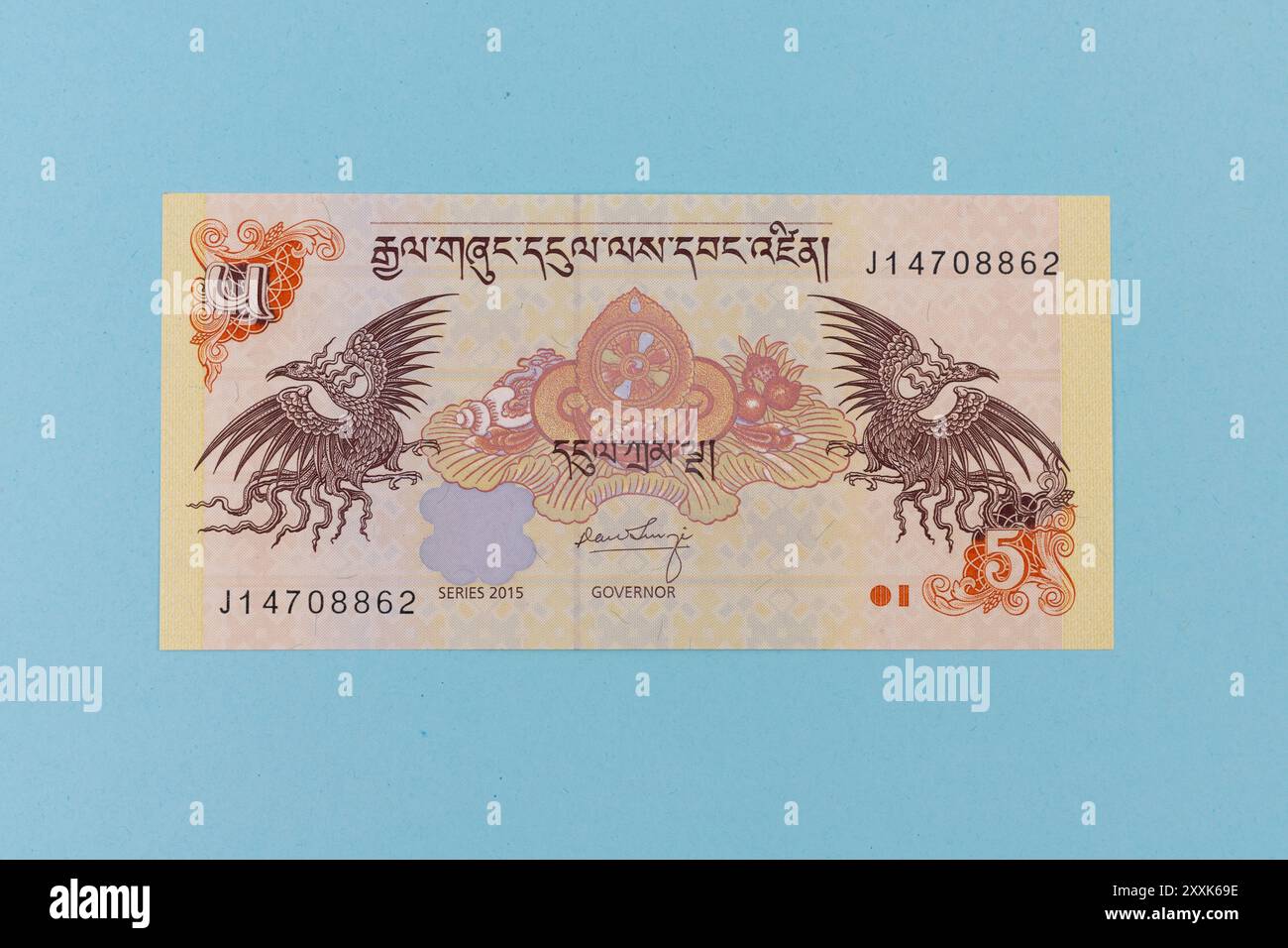Bhutan 5 Ngultrum Banknote with Birds and Religious Symbols Stock Photo ...