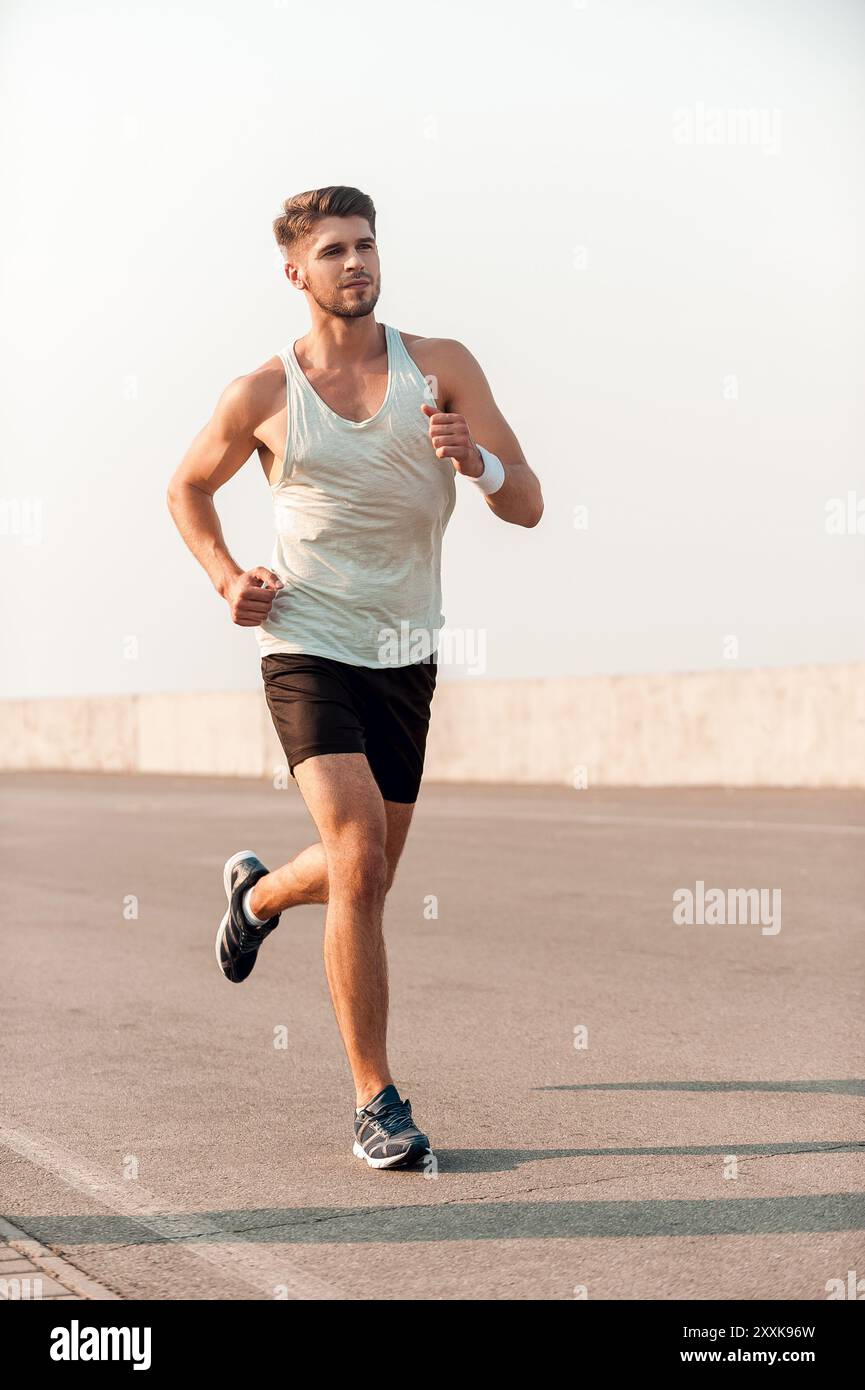 Finding inspiration in his training. Handsome young muscular man ...