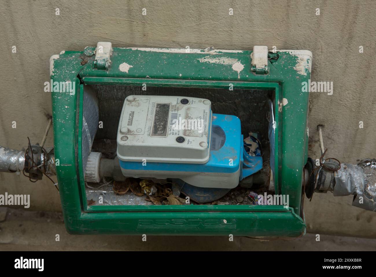 A water meter in the basement of a house, reading a water meter . Water ...