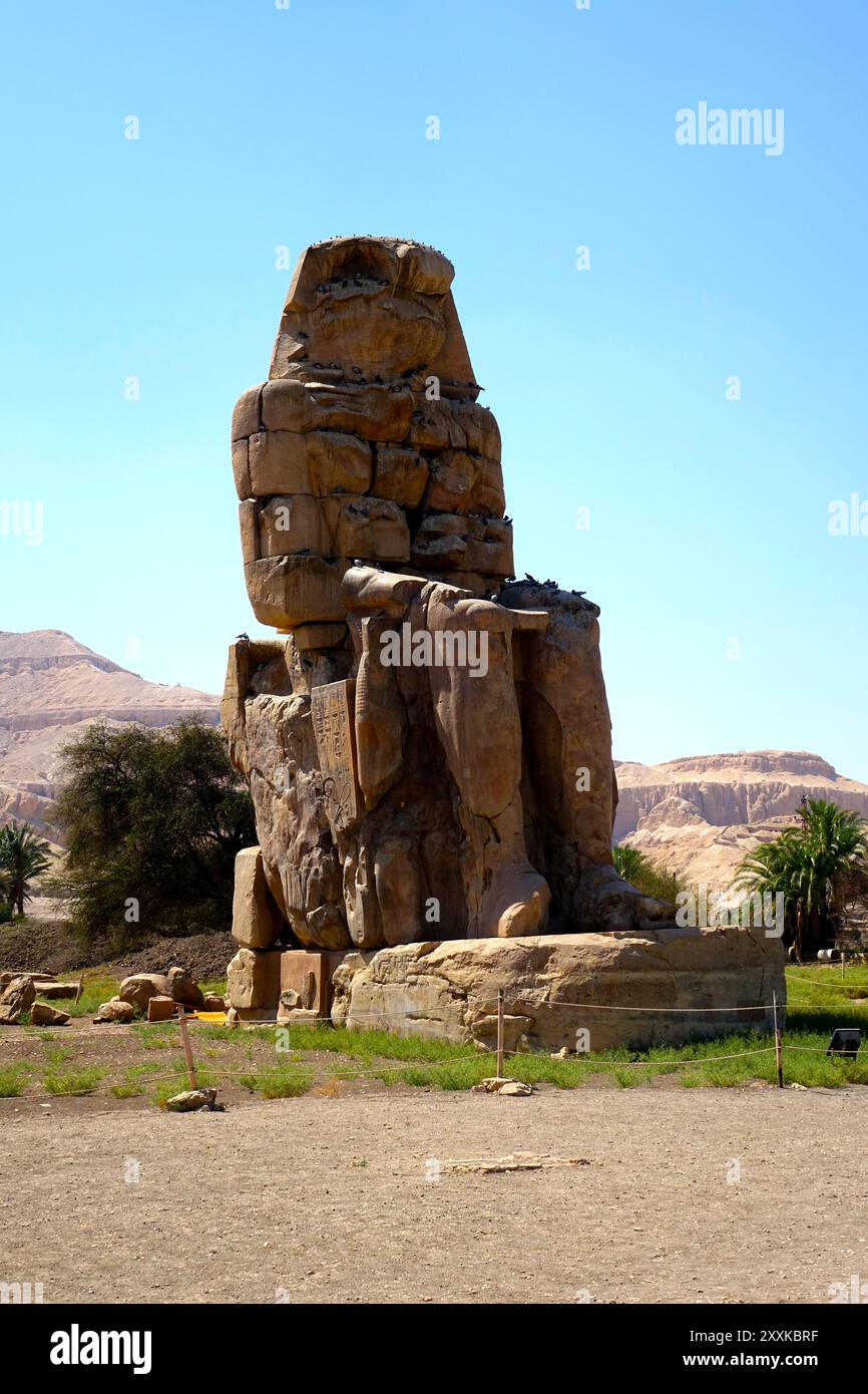 The Colossi of Memnon, towering statues of Pharaoh Amenhotep III, stand ...