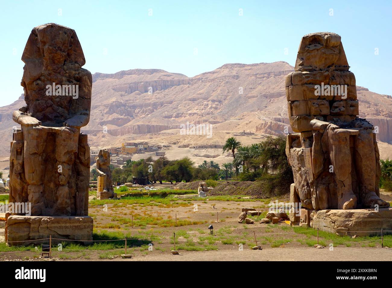 The Colossi of Memnon stands majestically against the backdrop of the ...