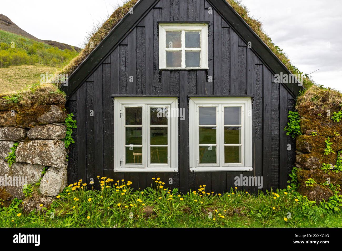 Traditional turf house in Skogar Open Air Museum, black wooden facade ...
