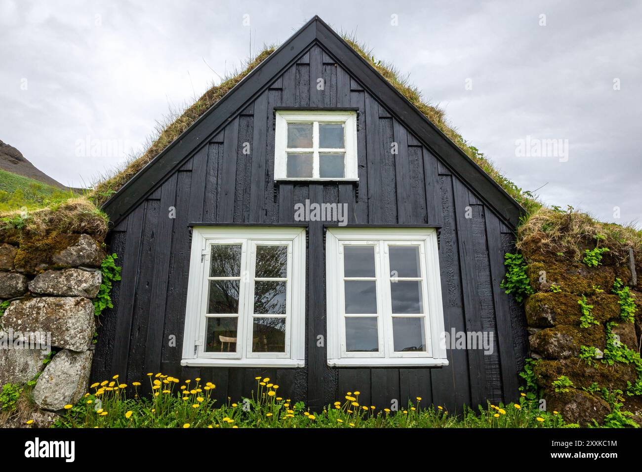 Traditional turf house in Skogar Open Air Museum, black wooden facade ...