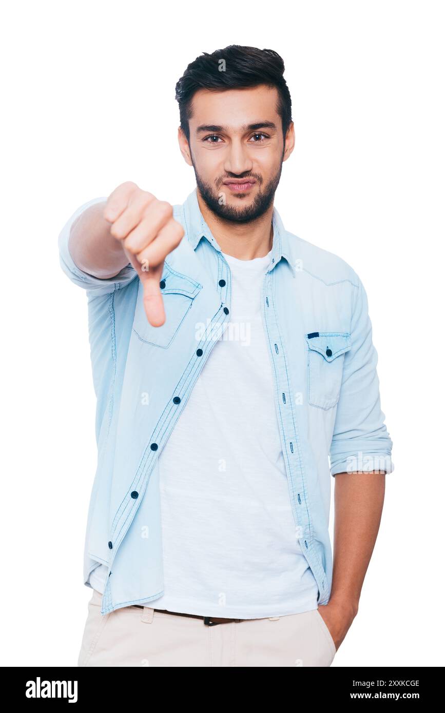 Too bad! Disappointed young Indian man showing his thumb down and ...