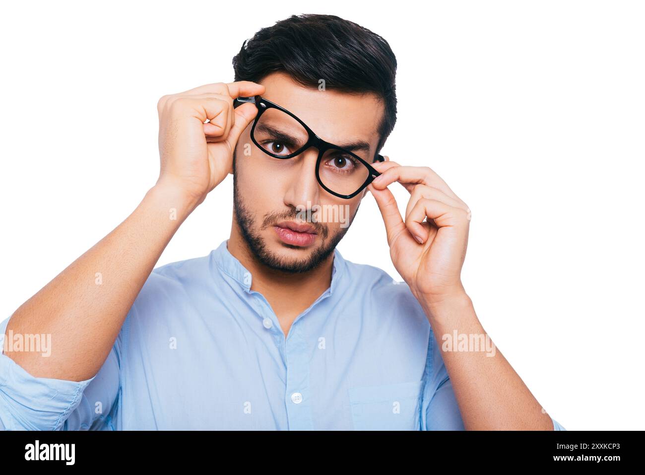 Something wrong with these eyeglasses. Frustrated young Indian man ...