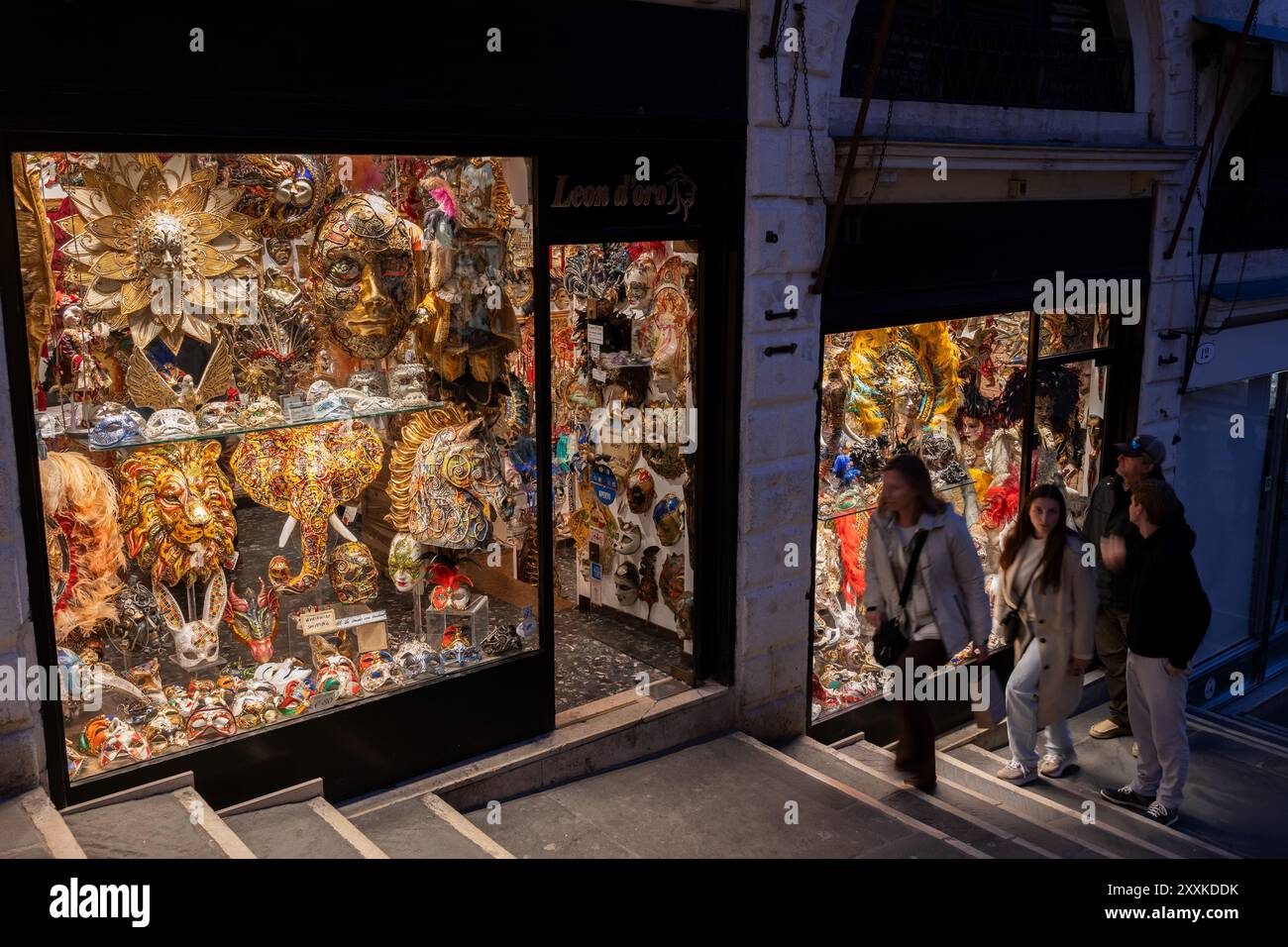 Venetian carnival masks in shop window on the Rialto Bridge at night in ...