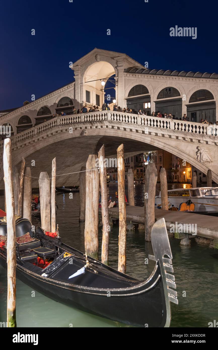 The Rialto Bridge at night in city of Venice, Italy. Stone arch ...
