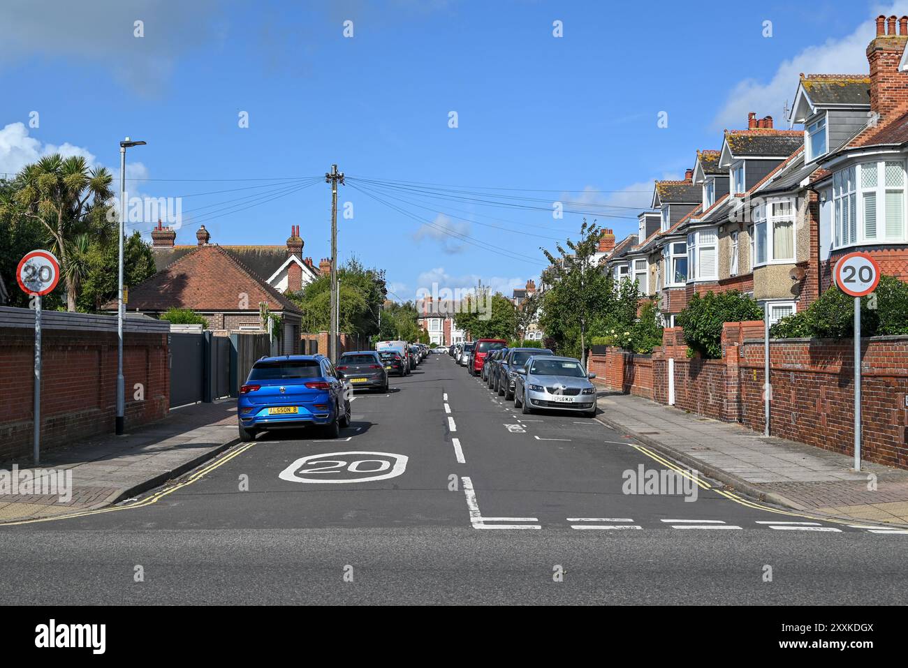 Residential English street with trees and parked cars. August 2024 ...