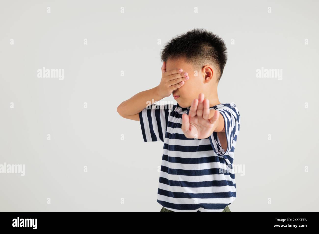 Stop hand of primary child. Asian little kid boy doing stop sing ...