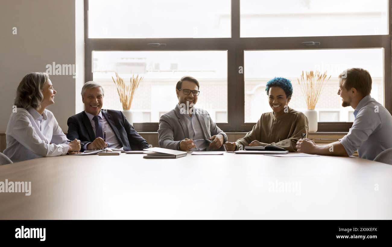 Business team seated around conference hi-res stock photography and ...