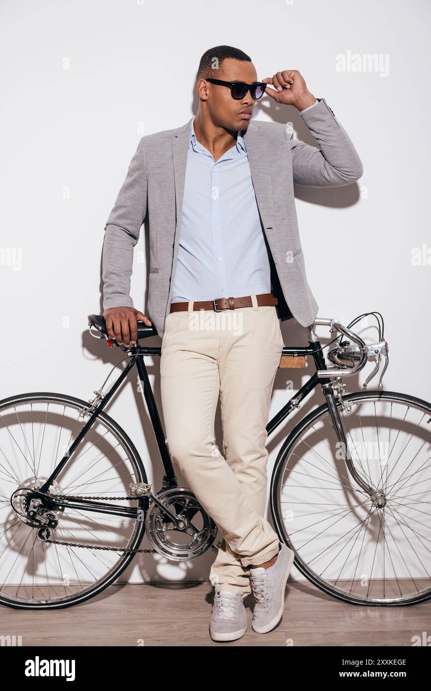 Confident in his perfect style. Full length of confident young African ...