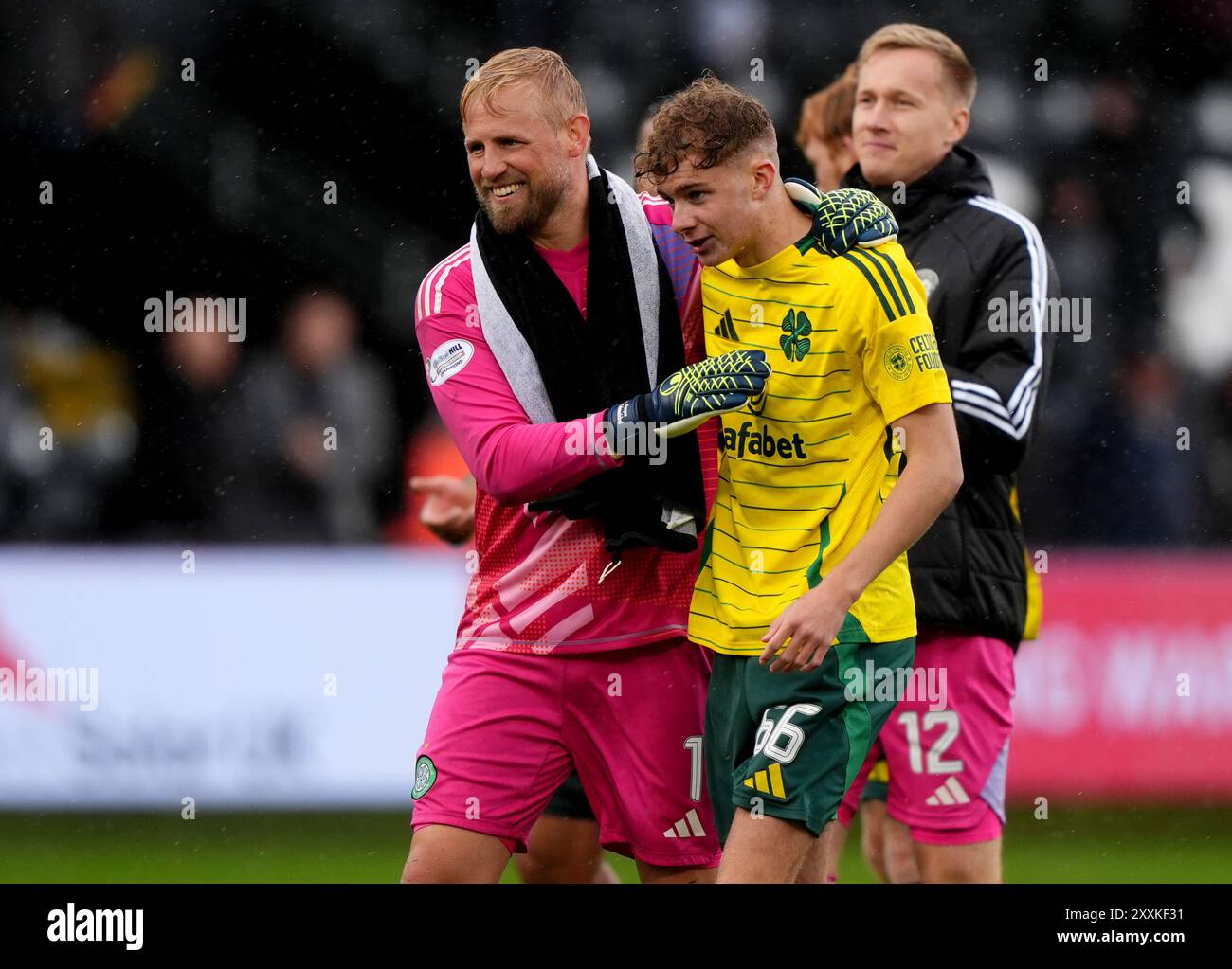 Celtic goalkeeper Kasper Schmeichel (left) and Francis Turley celebrate ...