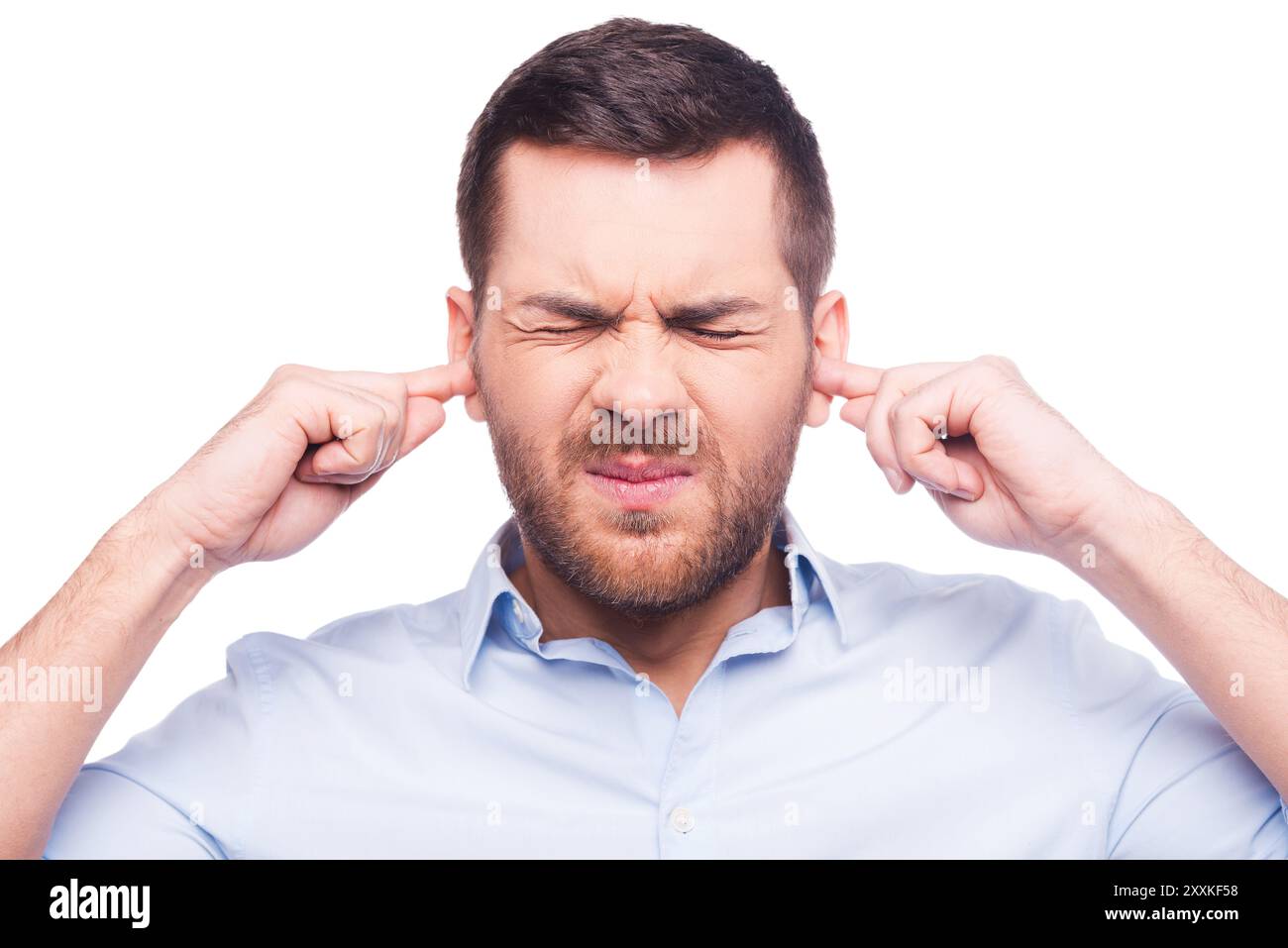This is too loud! Frustrated mature man in shirt holding fingers in his ...