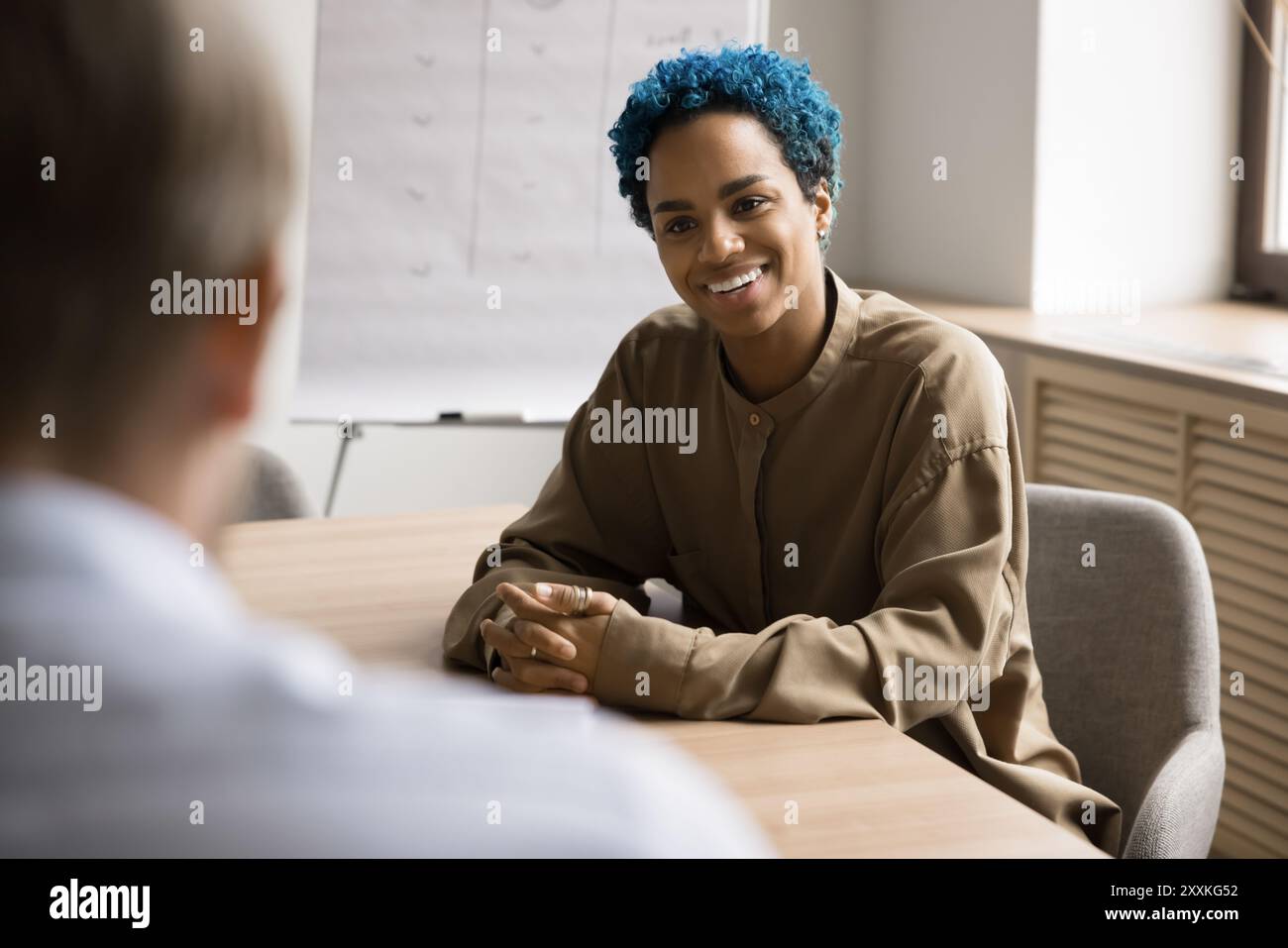 Creative profession woman applicant, smiling, answer questions passing ...