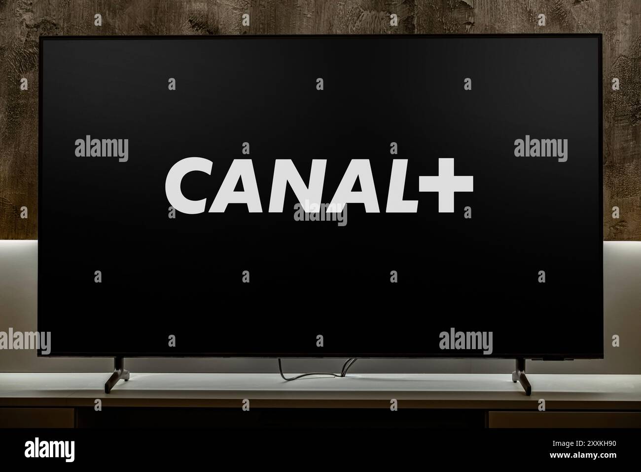 POZNAN, POL - DEC 19, 2023: Flat-screen TV set displaying logo of ...