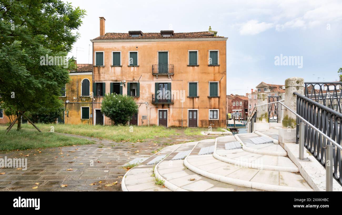 Venice, Italy, Classic orange building in the Castello quarter ...