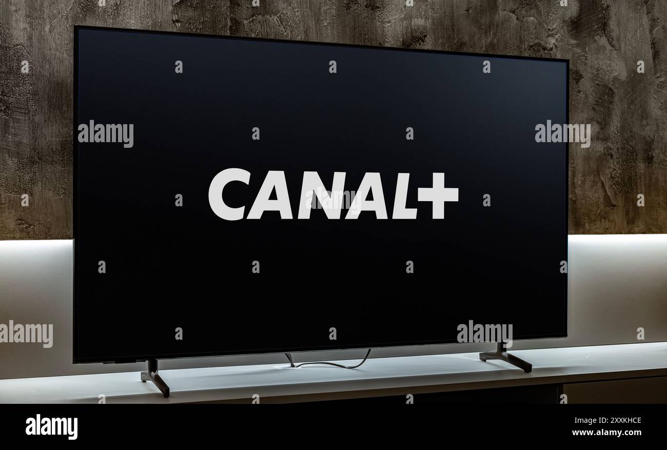 POZNAN, POL - DEC 19, 2023: Flat-screen TV set displaying logo of ...