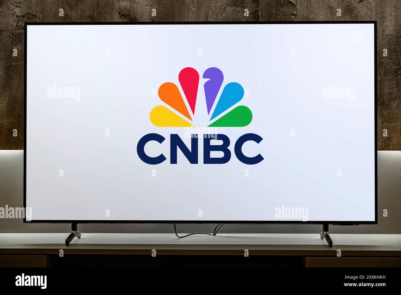 POZNAN, POL - DEC 19, 2023: Flat-screen TV set displaying logo of CNBC ...