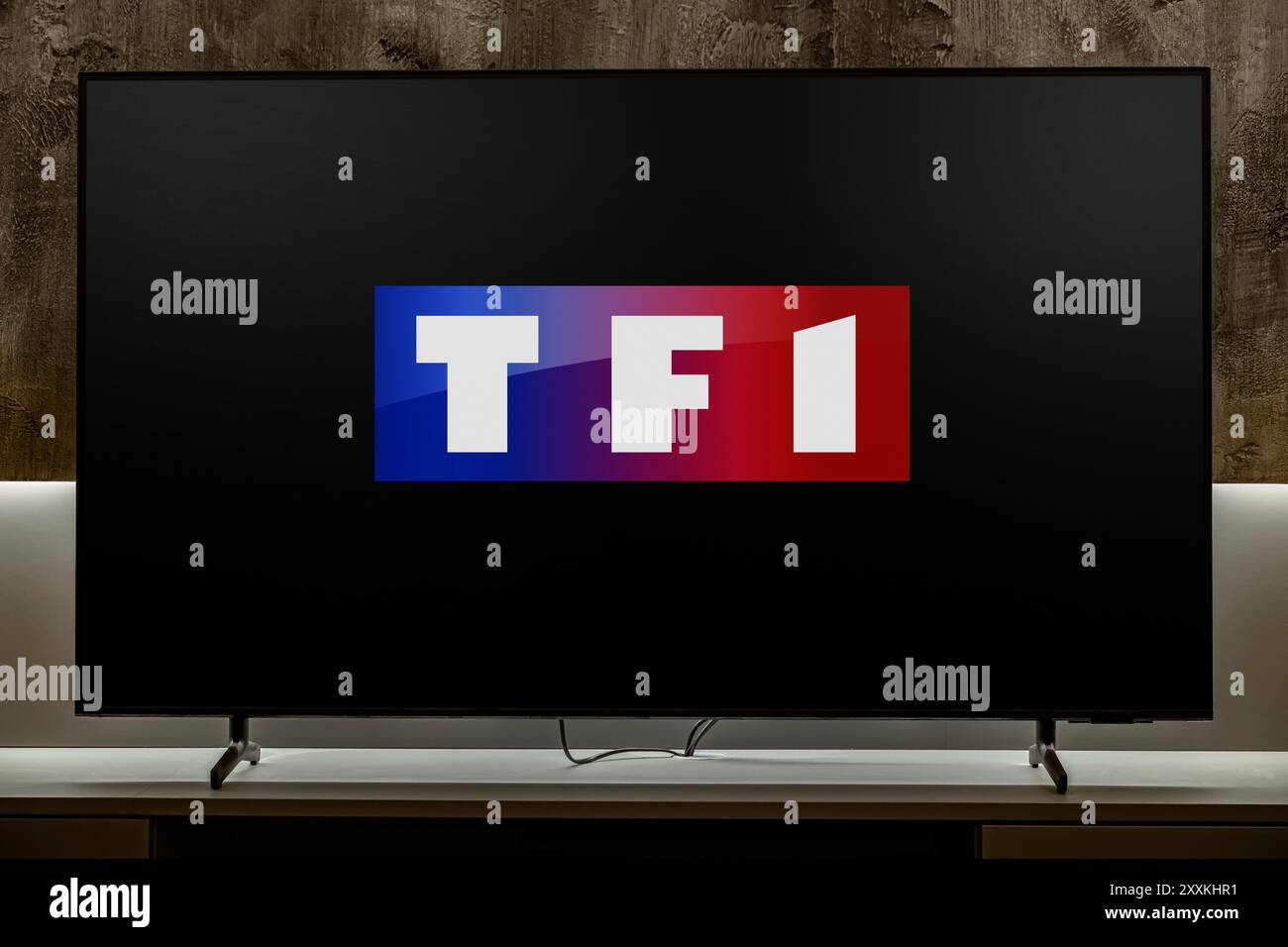 POZNAN, POL - DEC 19, 2023: Flat-screen TV set displaying logo of TF1 ...