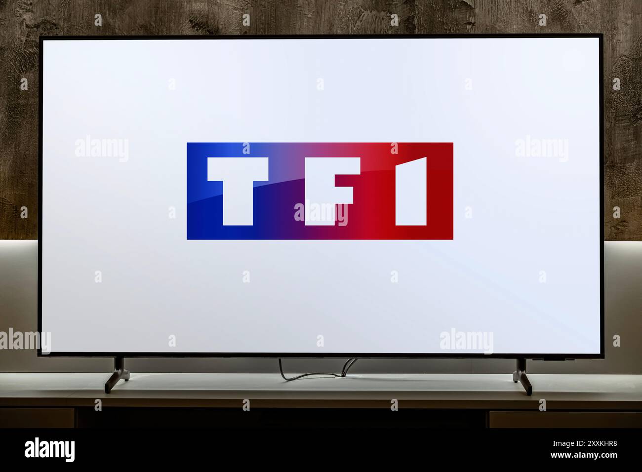 POZNAN, POL - DEC 19, 2023: Flat-screen TV set displaying logo of TF1 ...