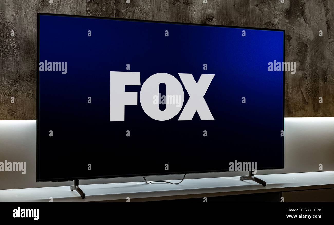 POZNAN, POL - DEC 19, 2023: Flat-screen TV set displaying logo of Fox ...