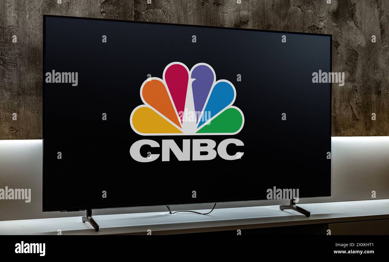 POZNAN, POL - DEC 19, 2023: Flat-screen TV set displaying logo of CNBC, an American pay ...