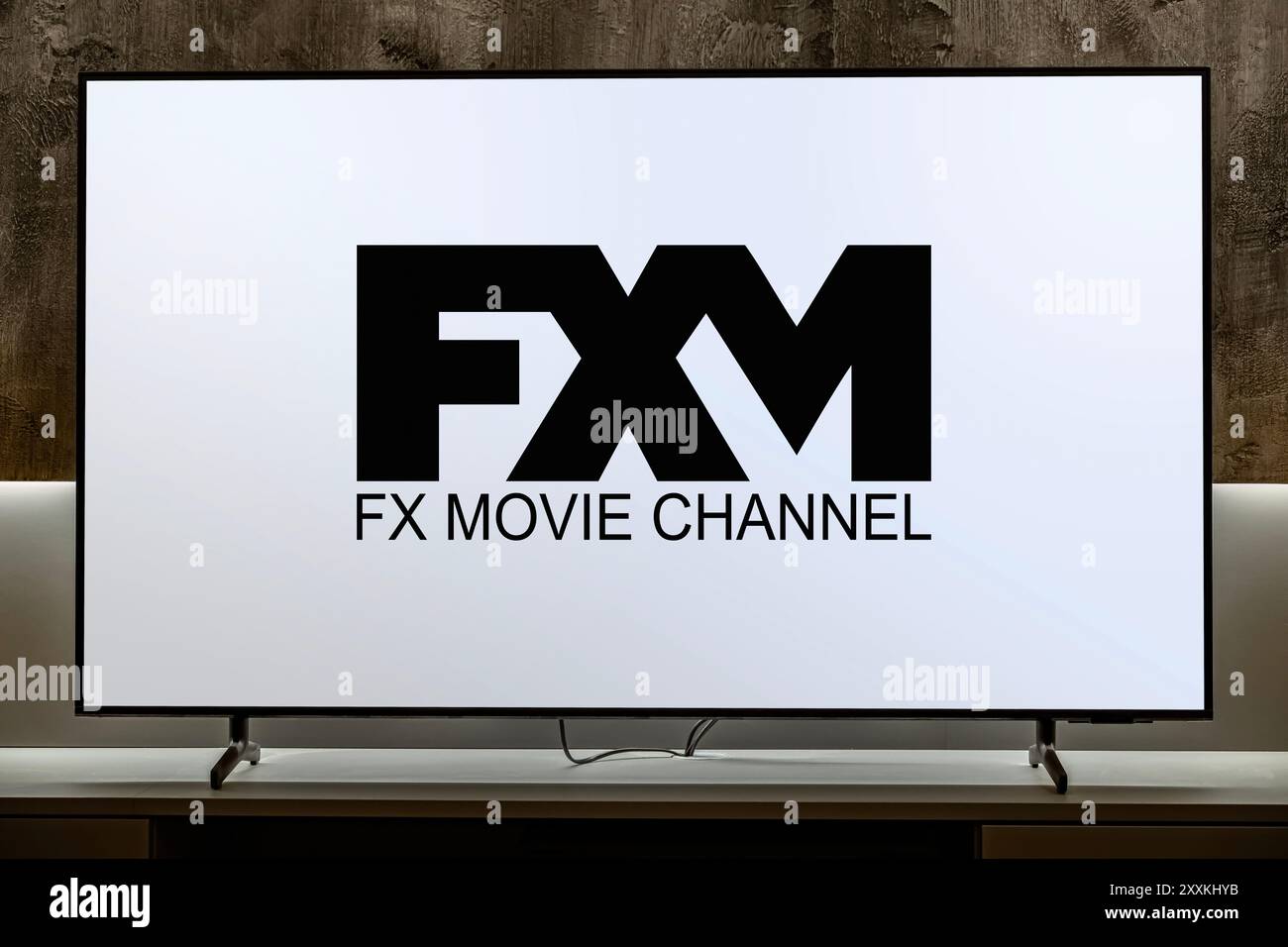 POZNAN, POL - MAR 01, 2024: Flat-screen TV set displaying logo of FX Movie Channel, an American ...