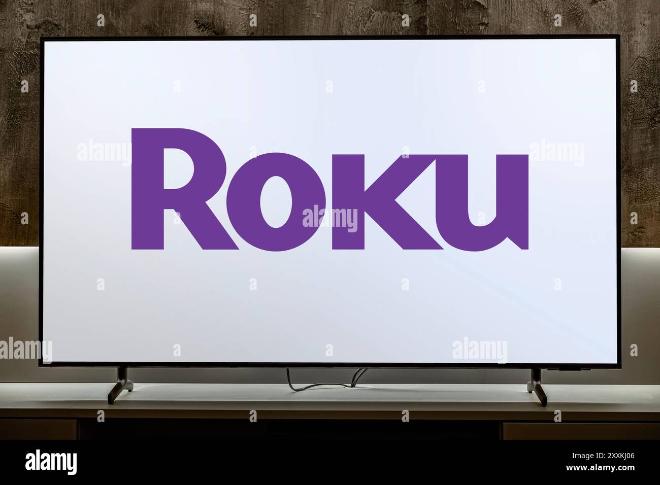 POZNAN, POL - MAR 01, 2024: Flat-screen TV set displaying logo of Roku ...