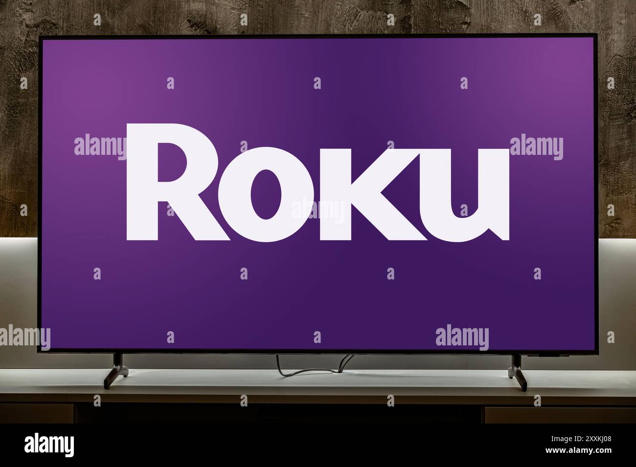 POZNAN, POL - MAR 01, 2024: Flat-screen TV set displaying logo of Roku ...