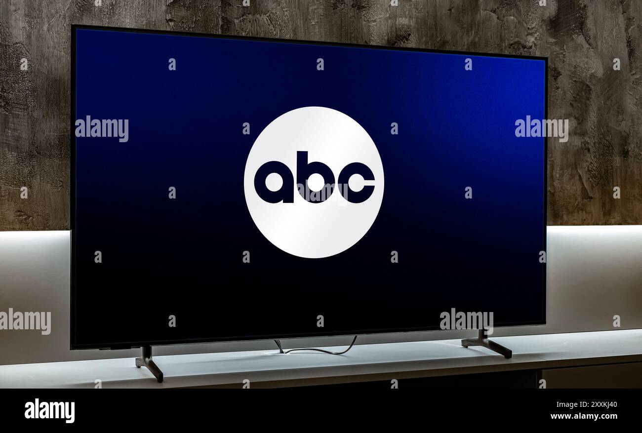 POZNAN, POL - MAR 01, 2024: Flat-screen TV set displaying logo of the ...