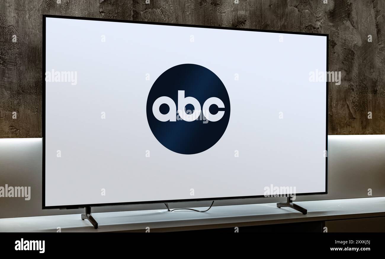 POZNAN, POL - MAR 01, 2024: Flat-screen TV set displaying logo of the American Broadcasting ...
